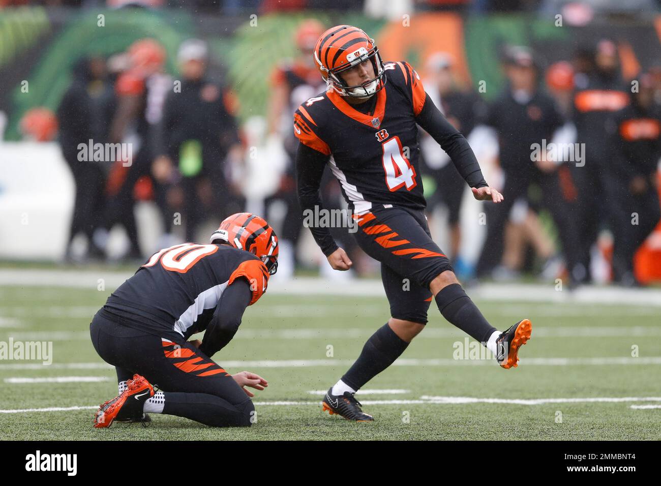 Cincinnati Bengals kicker Randy Bullock (4) kicks an extra point in the ...