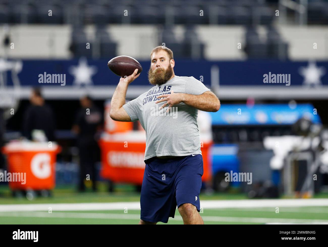 Dallas Cowboys center Travis Frederick throws during warm-ups before an ...