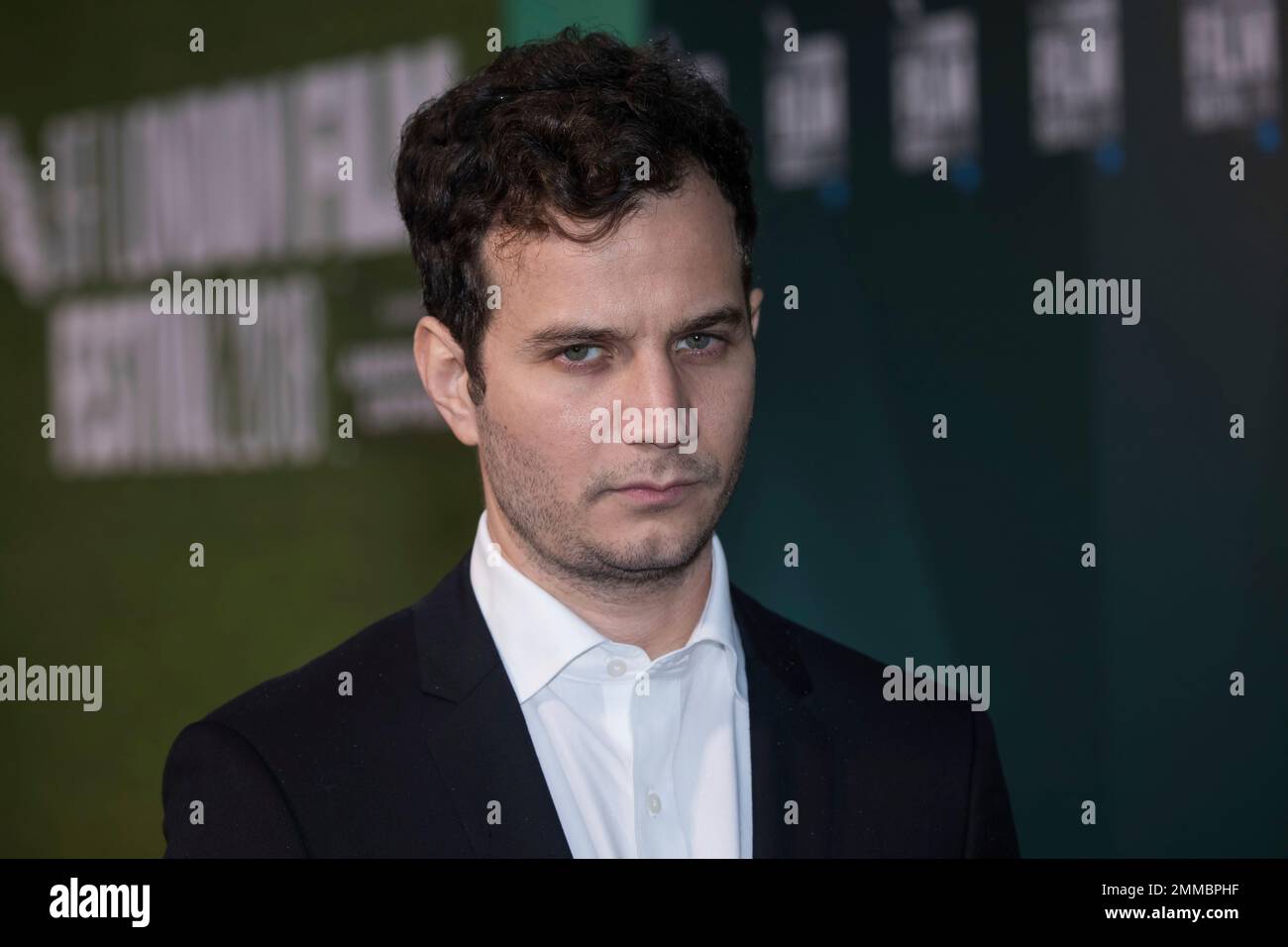 Michael Moshonov poses for photographers upon arrival at the premiere ...