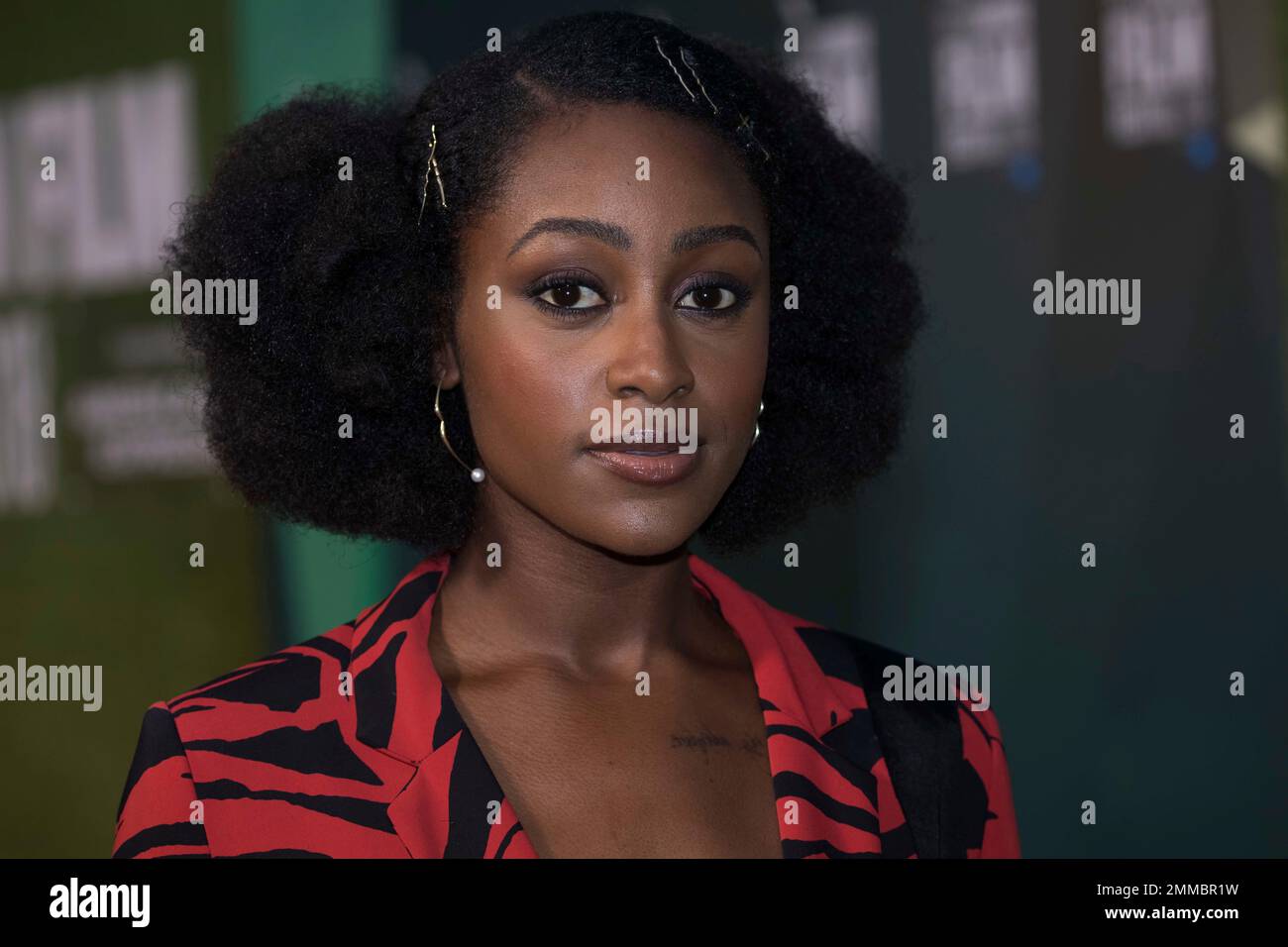Actress Simona Brown poses for photographers upon arrival at the ...