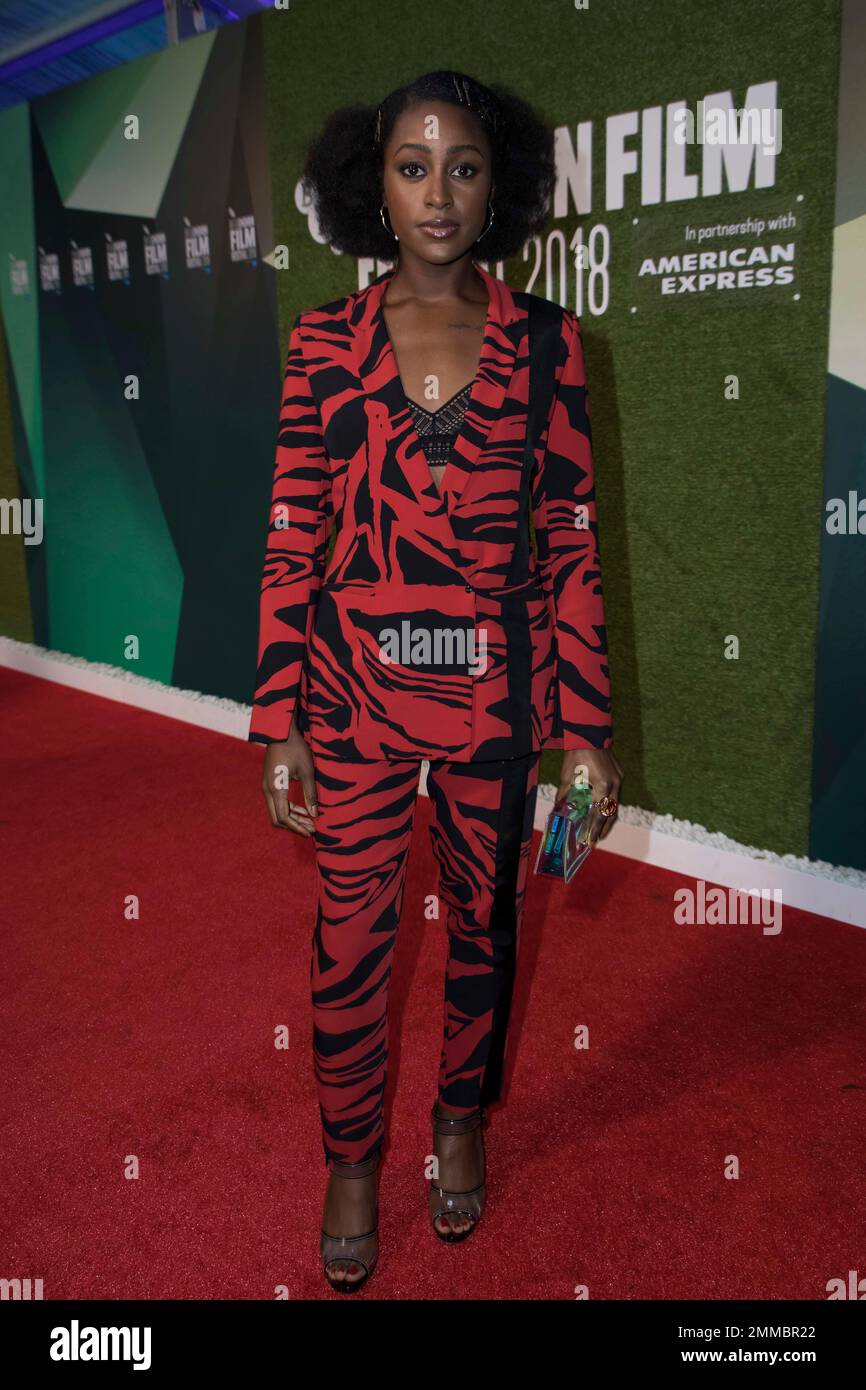 Actress Simona Brown poses for photographers upon arrival at the ...