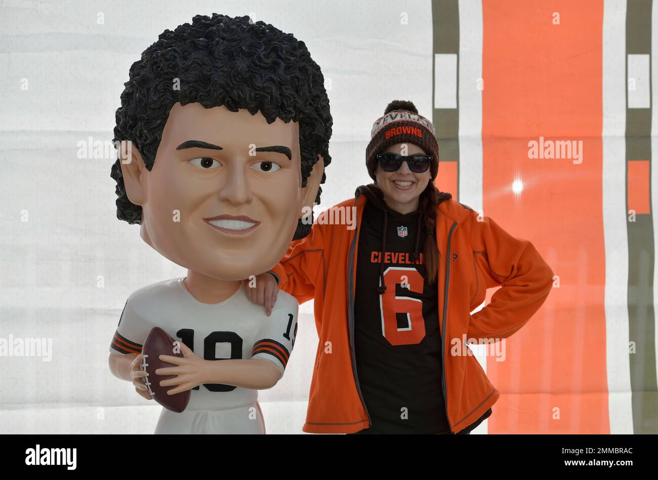 Taryn Wolfe stands next to a life-size Bernie Kosar bobblehead before ...