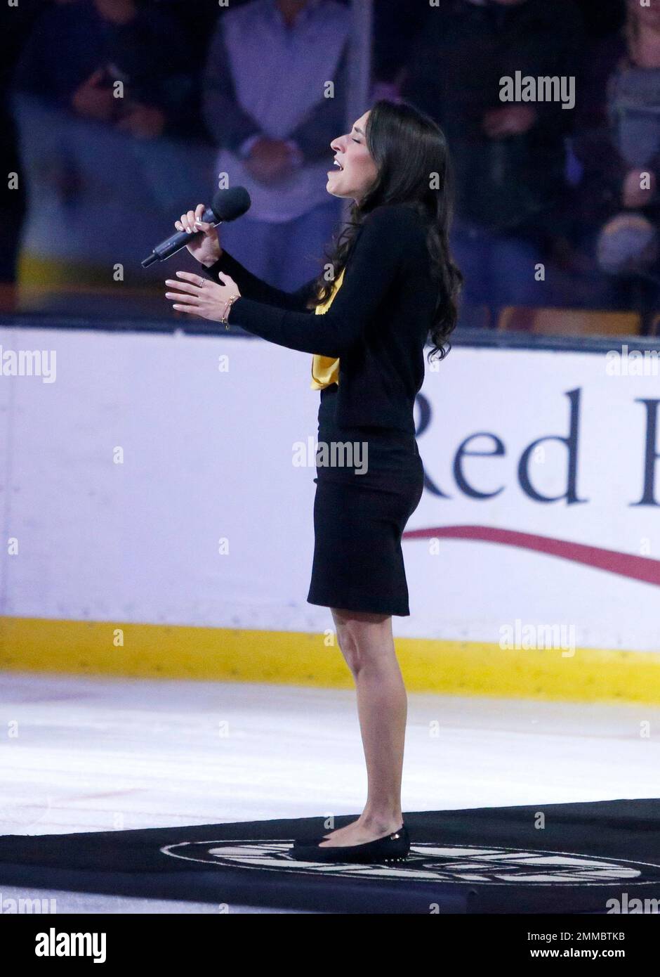 Dayna Fisk sings the national anthem before the start of an NHL hockey ...