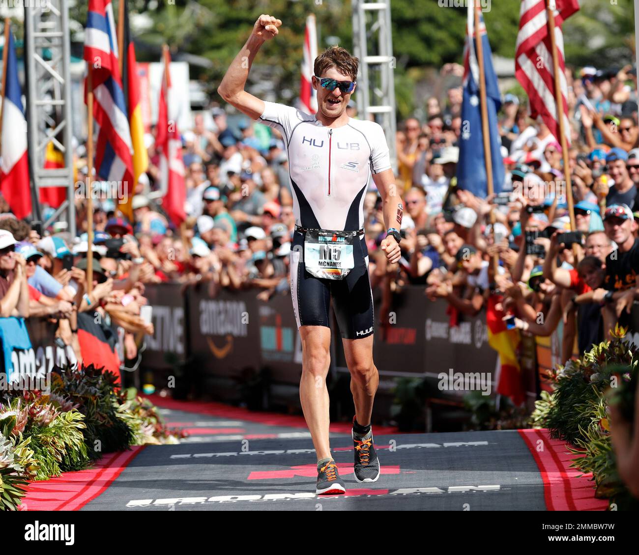 David McNamee, of England, reacts as he crosses the finish line in ...