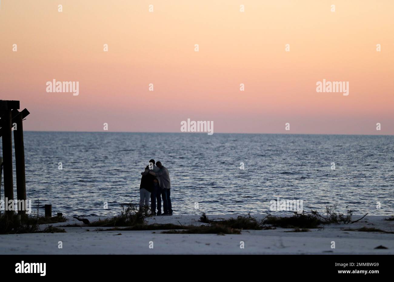 Lavonia Fortner, left, embraces her son Matthew Fortner, center, and ...