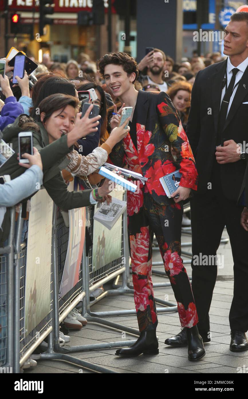 Actor Timothee Chalamet poses for photographs with fans upon arrival at ...