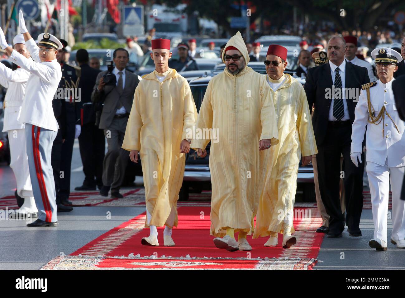 Moroccan King Mohammed VI flanked by his brother Prince Moulay Rachid ...