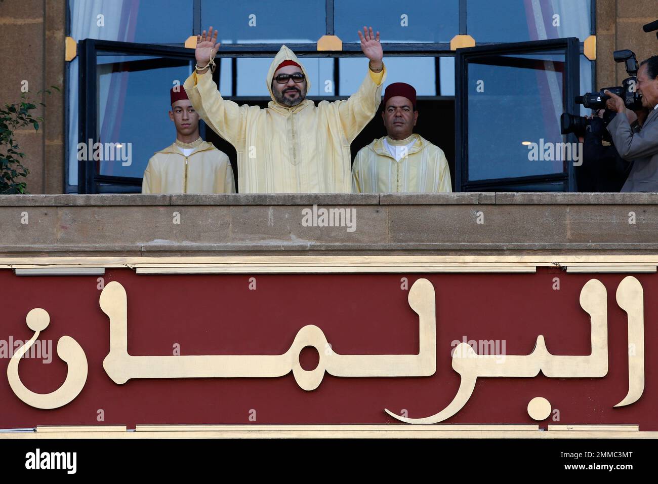 Moroccan King Mohammed VI flanked by his brother Prince Moulay Rachid, right, and the crown ...