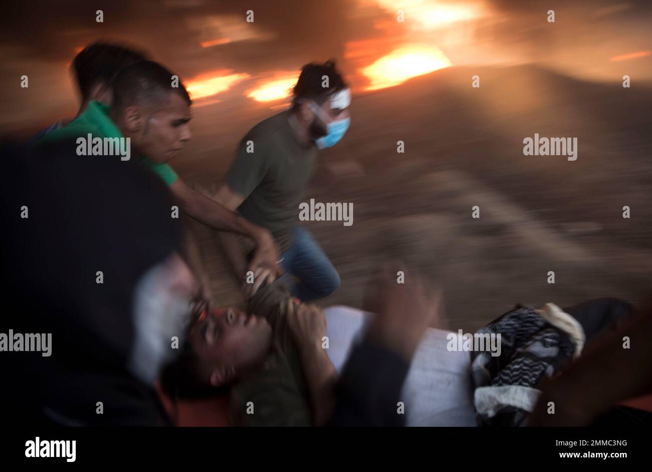 Palestinian protesters evacuate a wounded man was shot by Israeli ...
