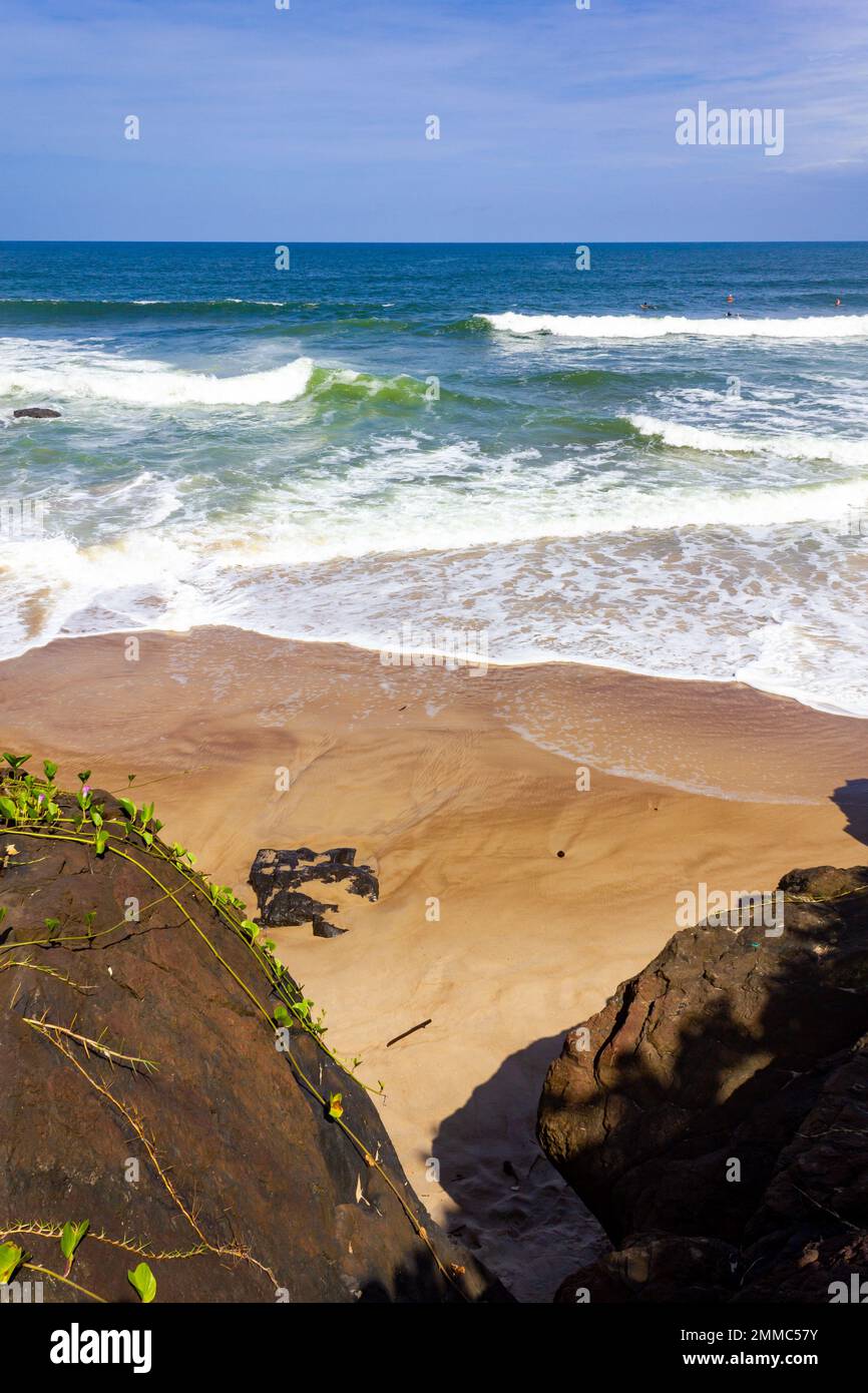 Rocks, waves, sand and vegetation at Praia do Resende beach, Itacare ...