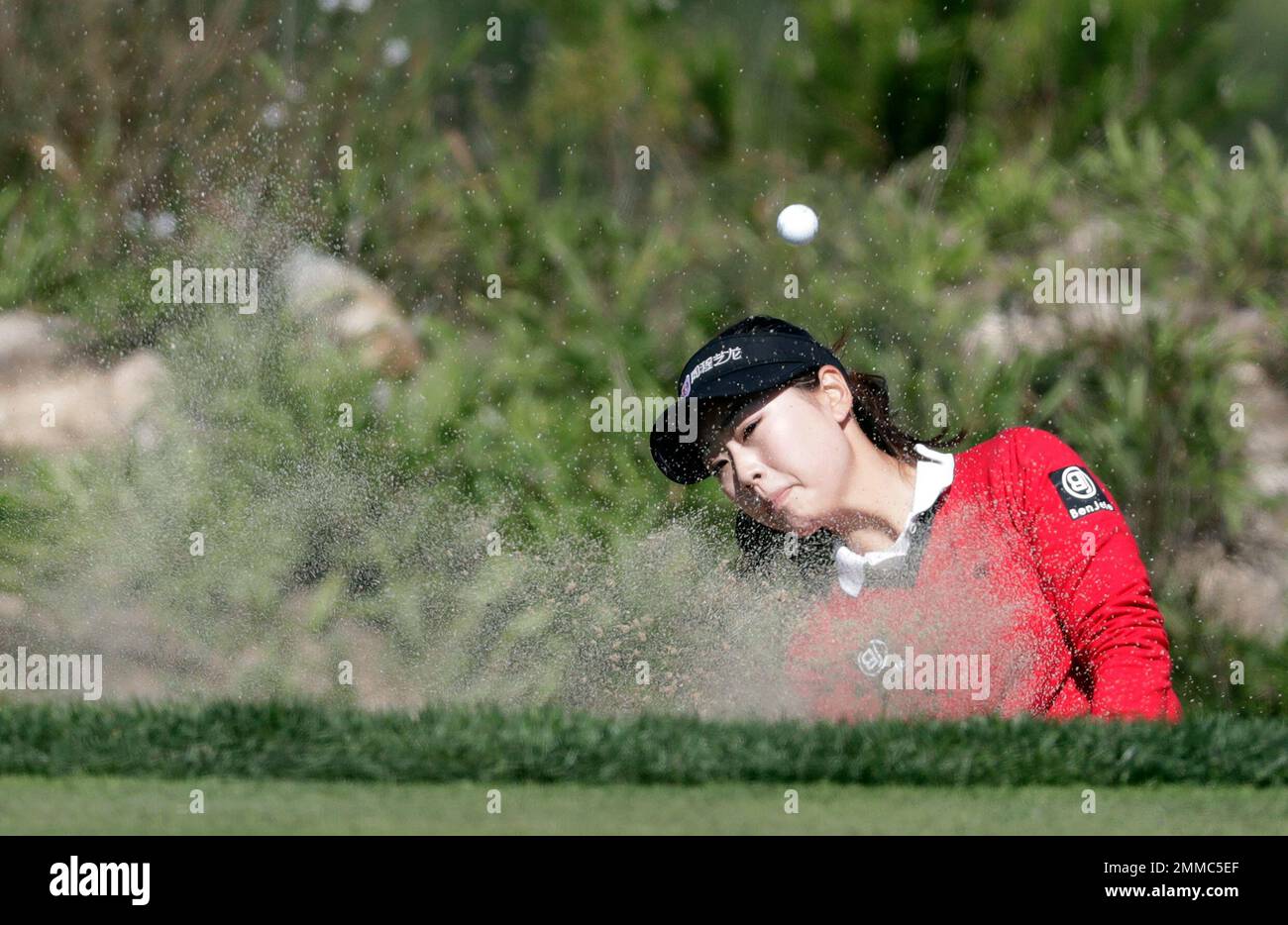 Xiang Sui of China hits a shot out of a bunker on the 6th hole during ...