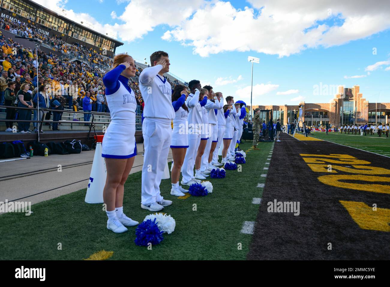 The Air Force Academy cheer team salutes the flag during the national ...