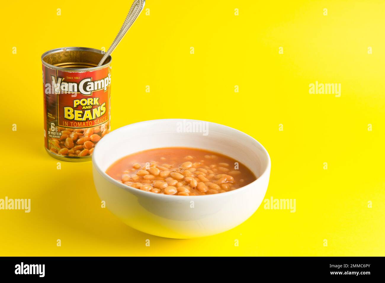 tin of Van Camps Pork and Beans Baked Beans stand out on a yellow ...