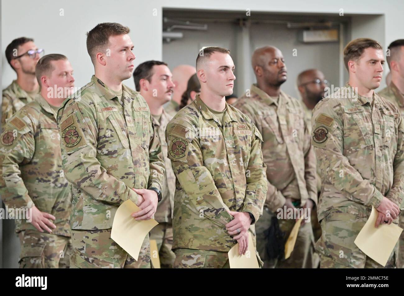 U.S. Air Force Airmen gather for an announcement from Col. Russell Cook ...