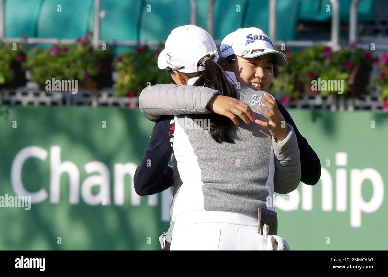 Nasa Hataoka, right, of Japan hugs Minjee Lee of Australia after finishing the first round of ...