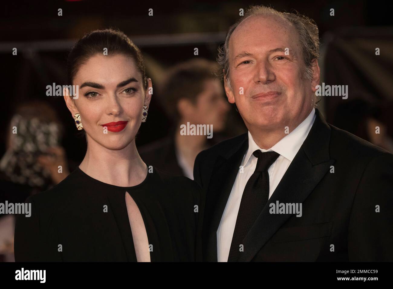 Zoe Zimmer and Hans Zimmer pose for photographers upon arrival at the ...