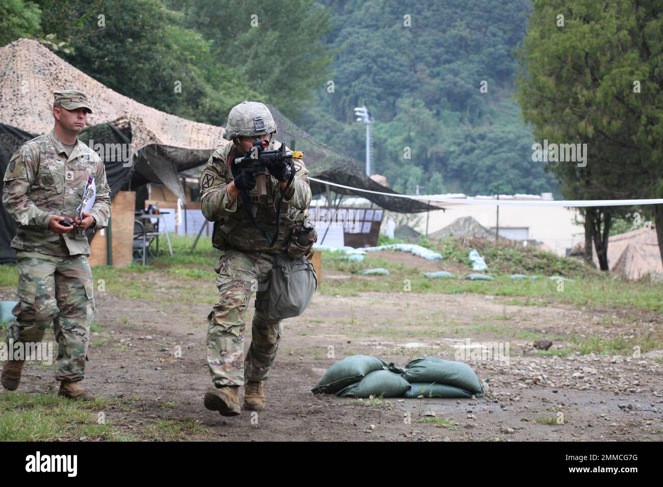 EFMB Candidate conducts the react to direct fire portion of the Warrior ...