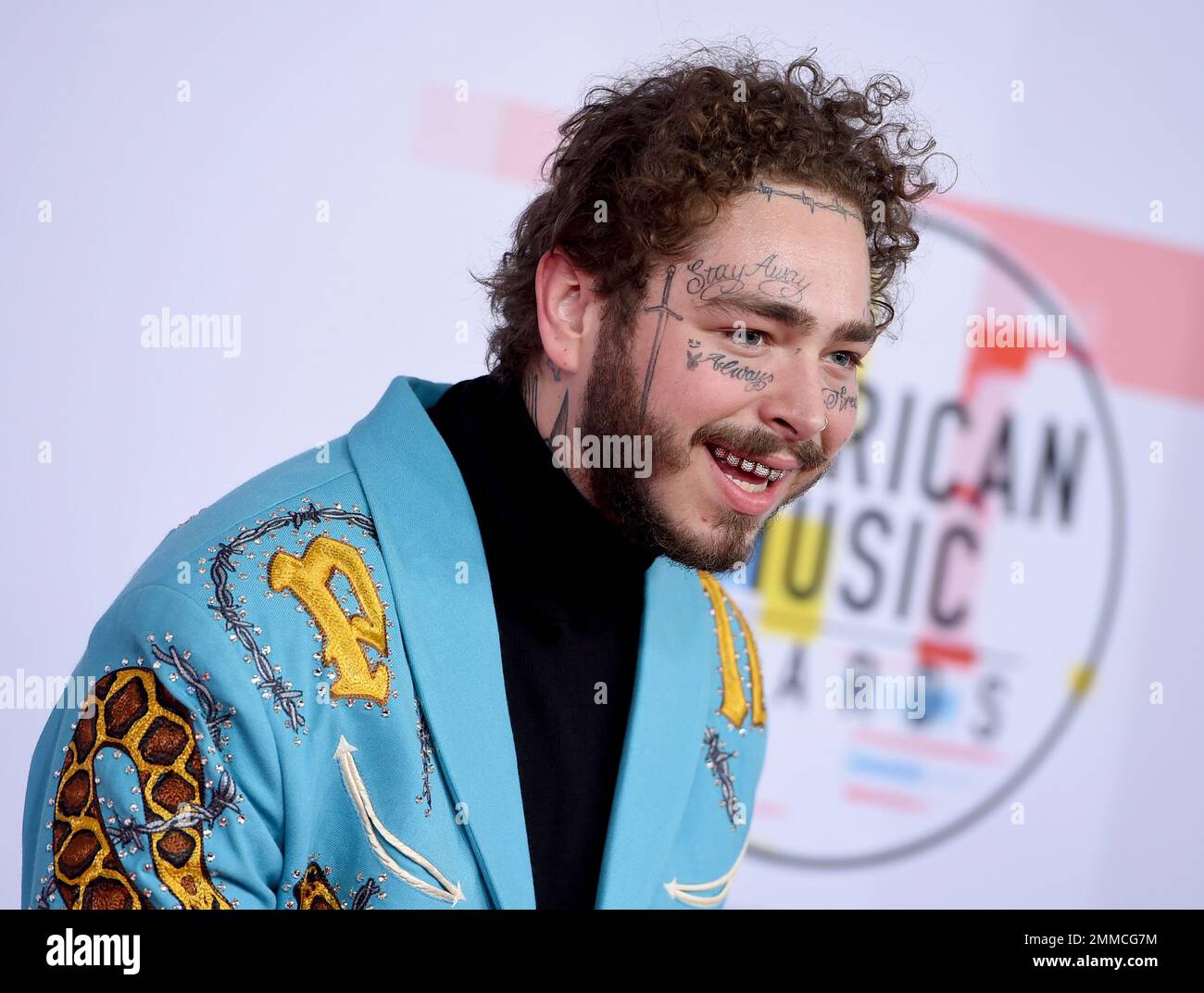 Post Malone arrives at the American Music Awards on Tuesday, Oct. 9 ...
