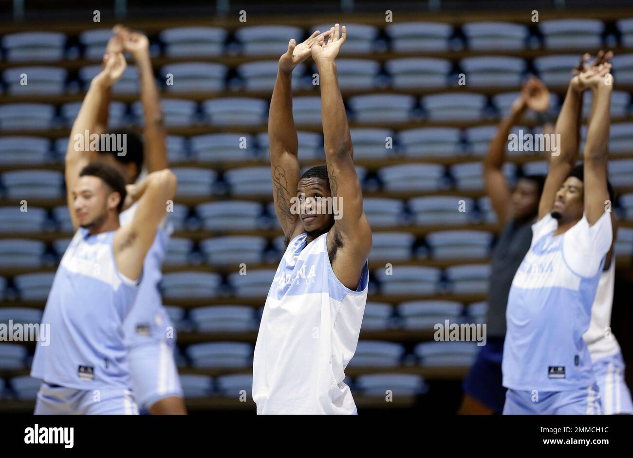 North Carolina's Kenny Williams, center, stretches during practice ...