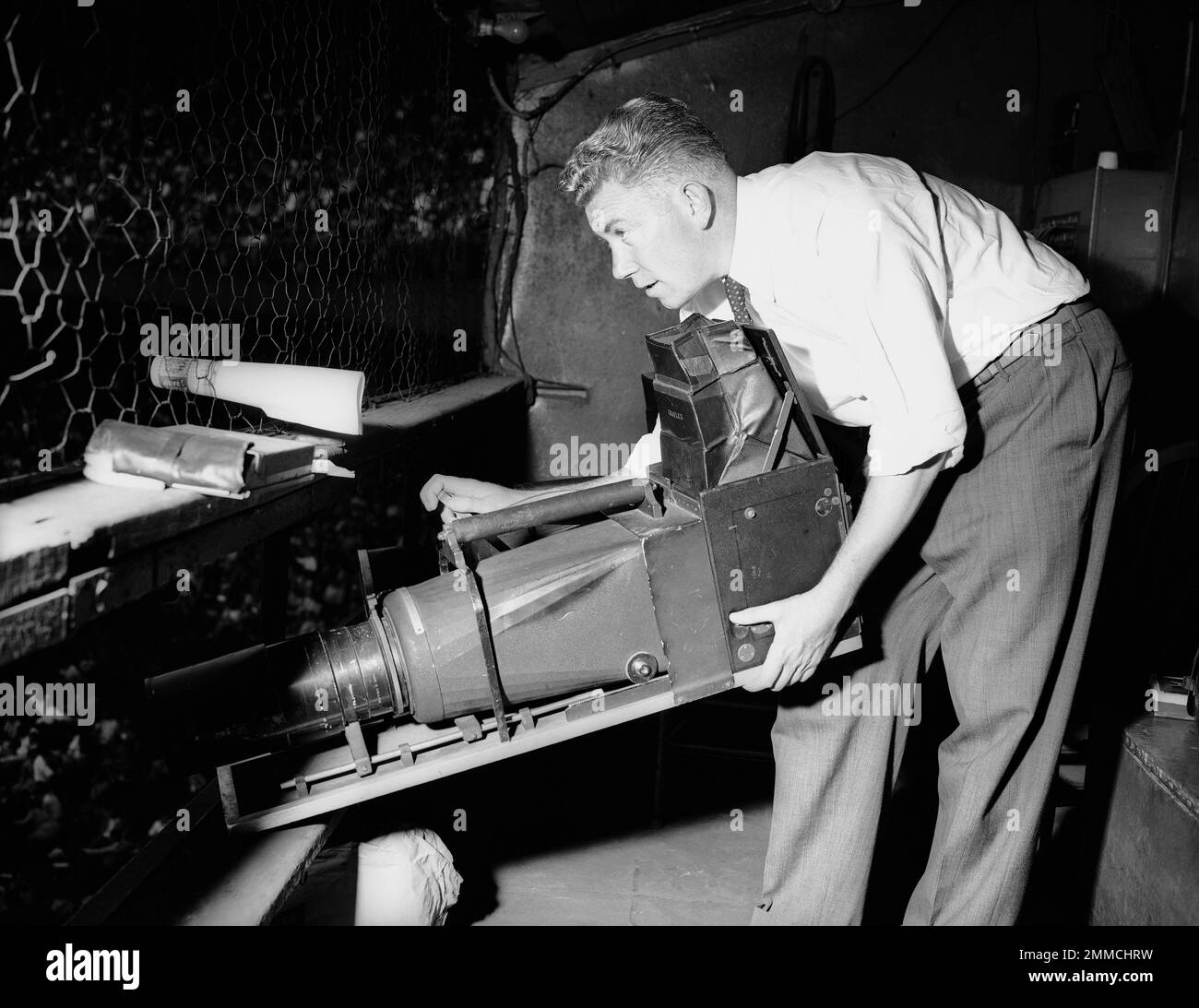 Associated Press staff photographer John Rooney is pictured using the ...