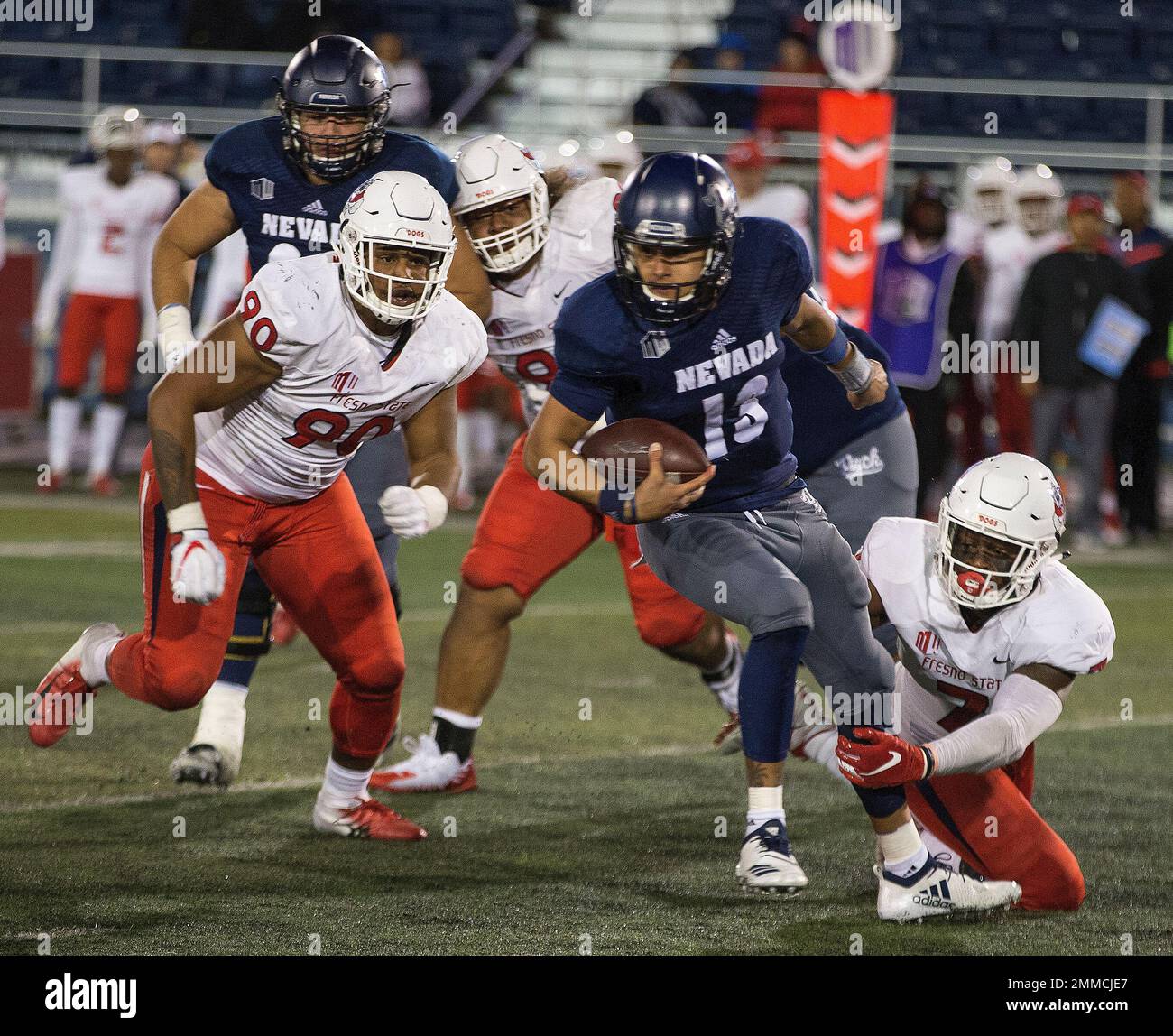 Nevada quarterback Cristian Solano (13) runs against Fresno State in ...