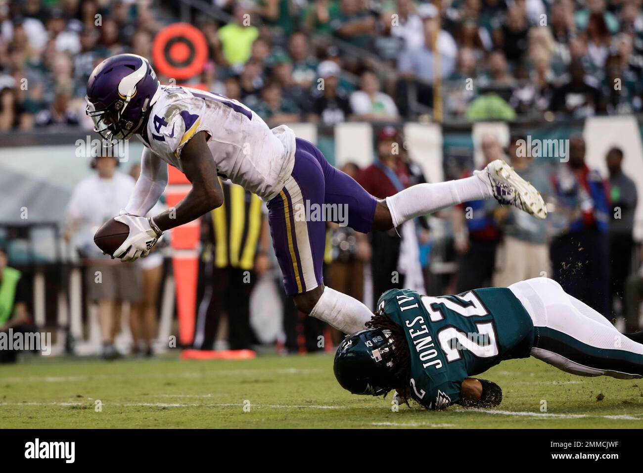 Minnesota Vikings wide receiver Stefon Diggs (14) is tackled by ...