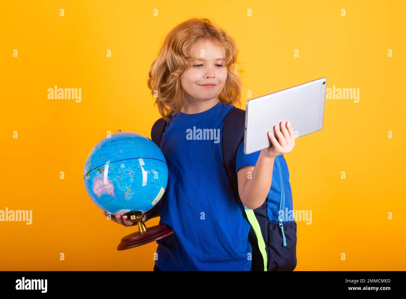 School boy world globe and tablet. School child. Kid boy from ...