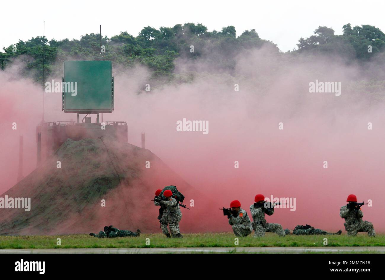 Fictitious enemy soldiers from Taiwan's special forces attack during a ...