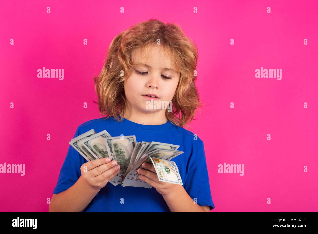 Cash money in dollar banknotes. Kid showing money dollar bills ...