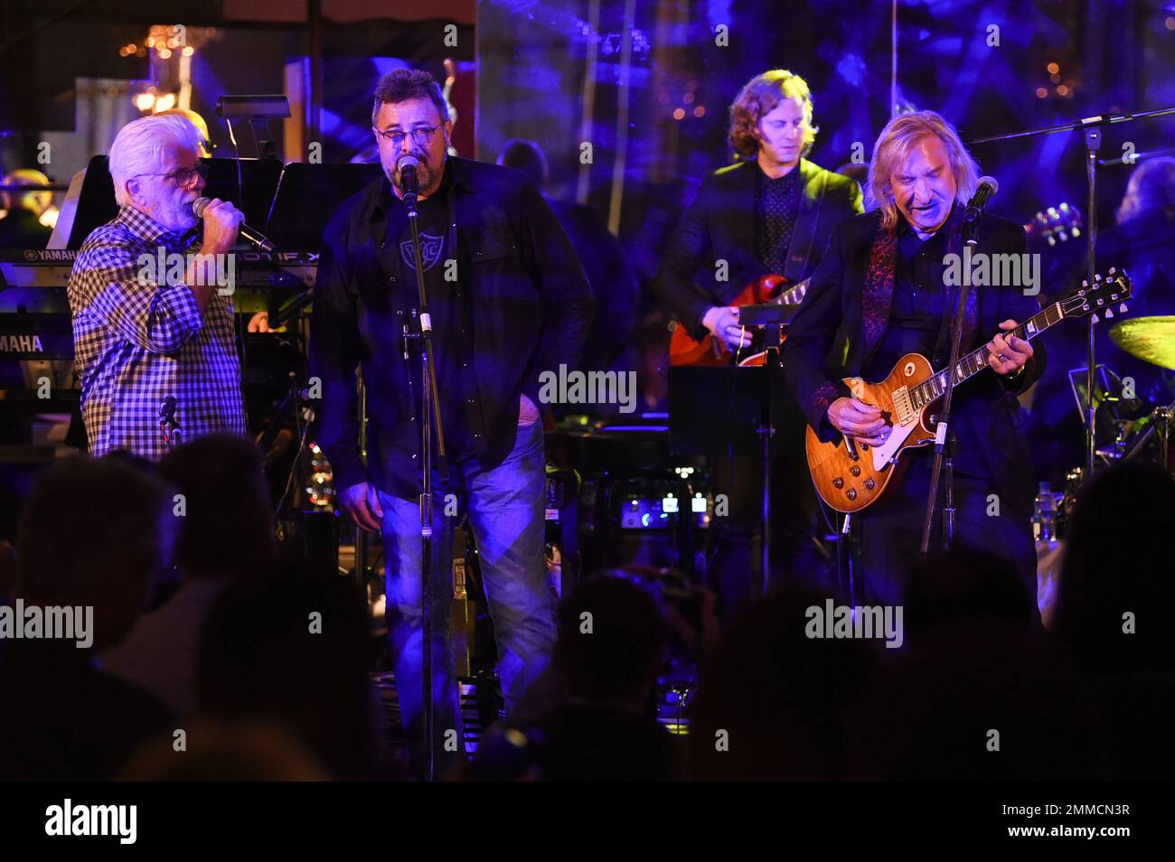 Musicians Michael McDonald, left, Vince Gill and Joe Walsh perform ...