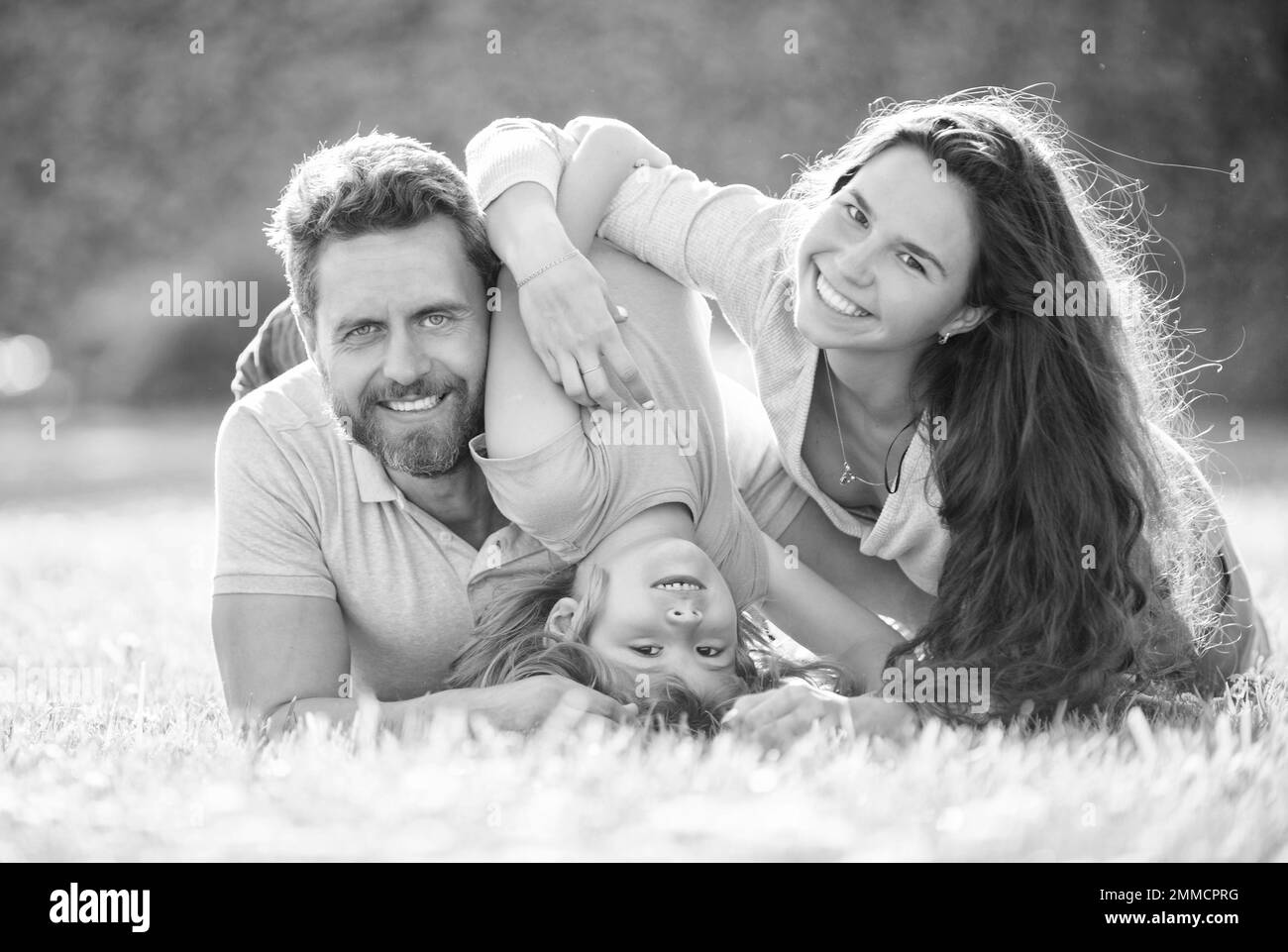 friendly family having fun in summer. happy parents with kid boy. mom ...