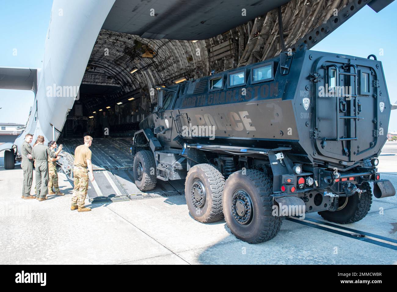 U.S. Air Force Airmen from the 15th and 16th Airlift Squadrons watch as ...