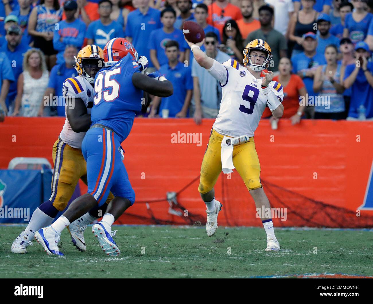 LSU quarterback Joe Burrow (9) throws a pass over Florida defensive ...