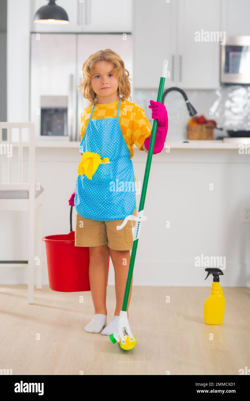 Cleaning at home. Little kid cleaning at home. Child doing housework ...