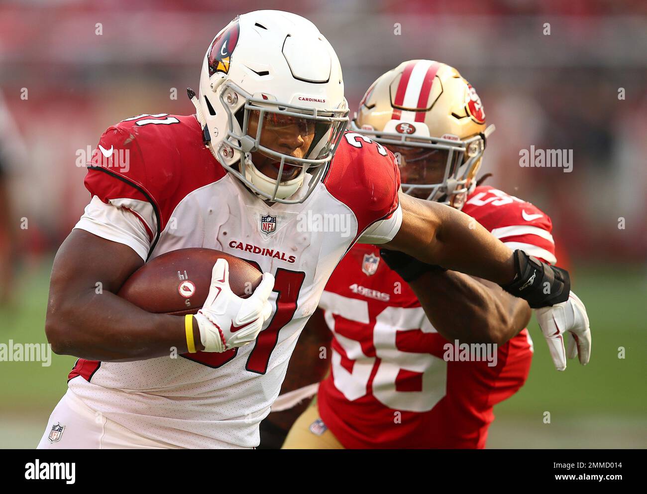 Arizona Cardinals running back David Johnson, left, runs in front of ...