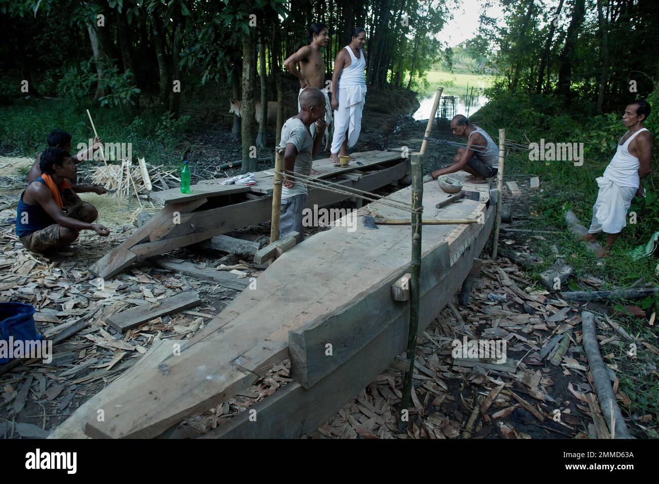In this Aug. 6, 2018 photo, monks, in white, instruct carpenters making ...