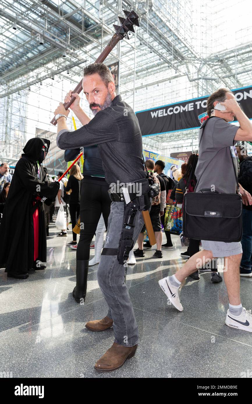 An attendee dressed as Rick Grimes from "The Walking Dead" poses for a ...