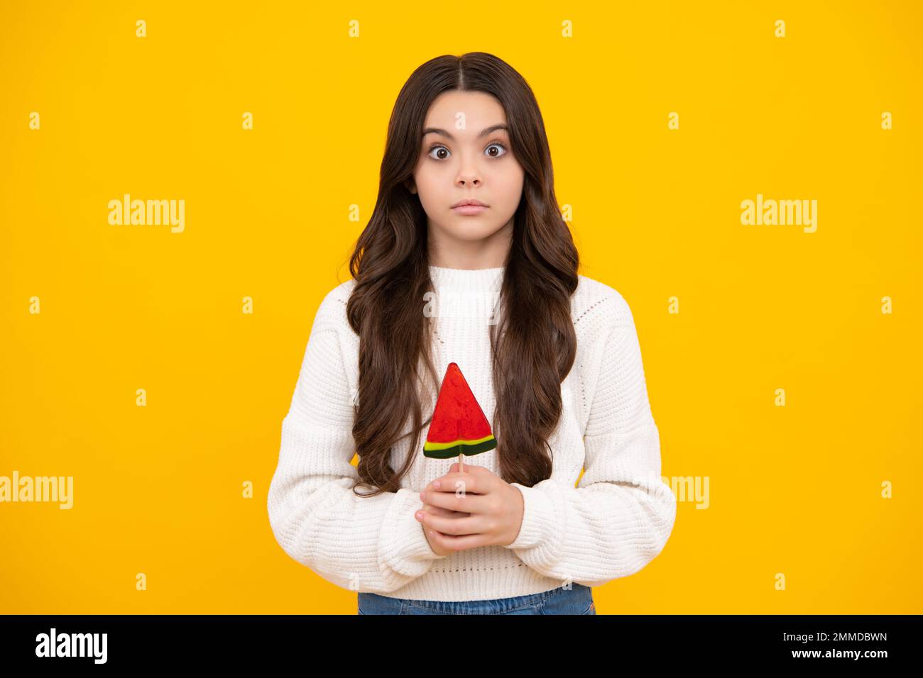 Surprised teenager girl. Teenager girl with caramel candies on sticks ...