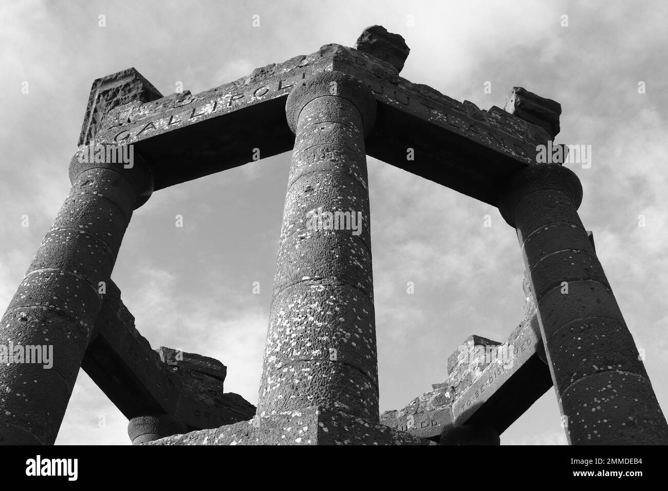 Stonehaven War Memorial with campaigns engraved on lintels. Lichen ...