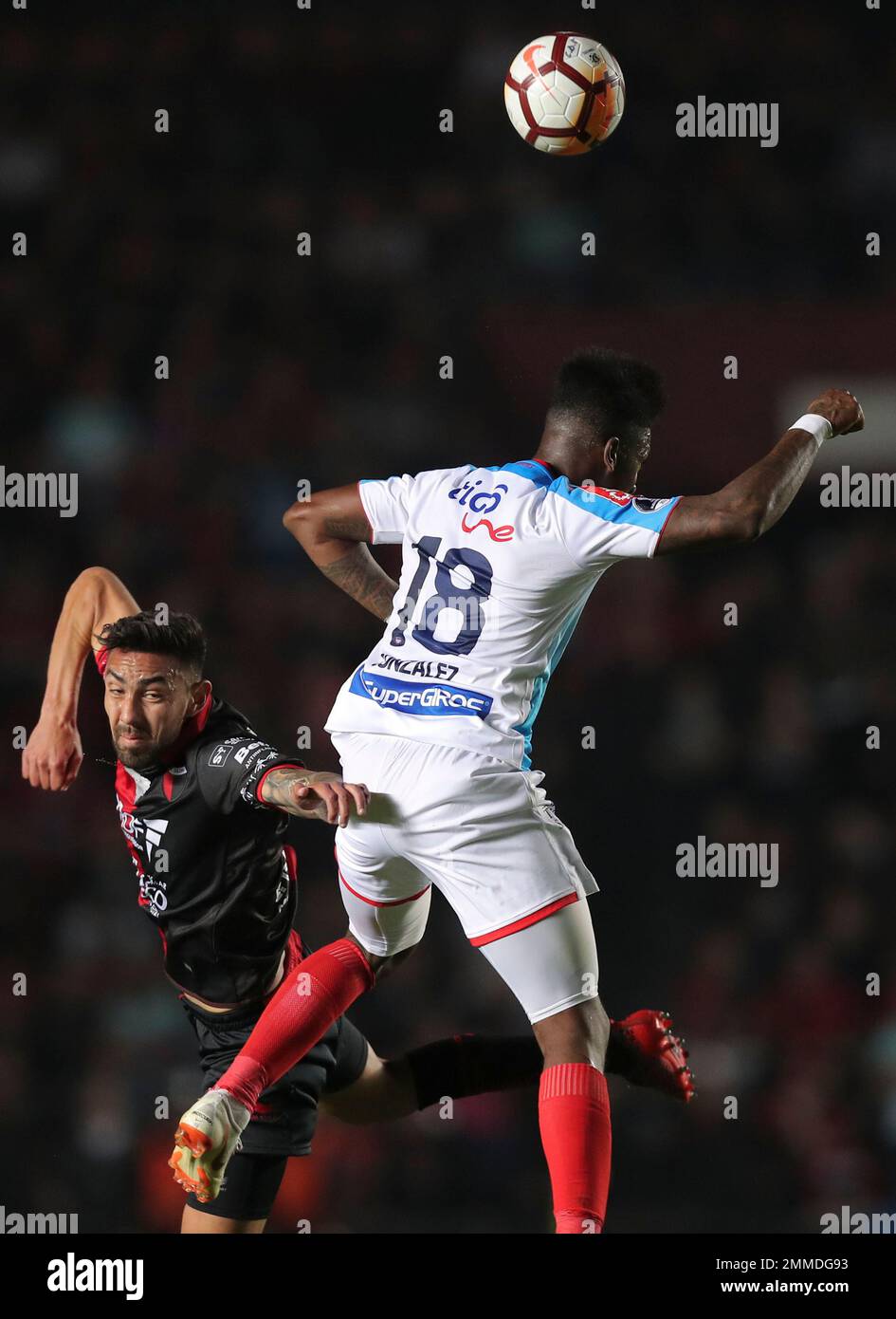 Yony Gonzalez of Junior de Barranquilla, right, fights for the ball ...