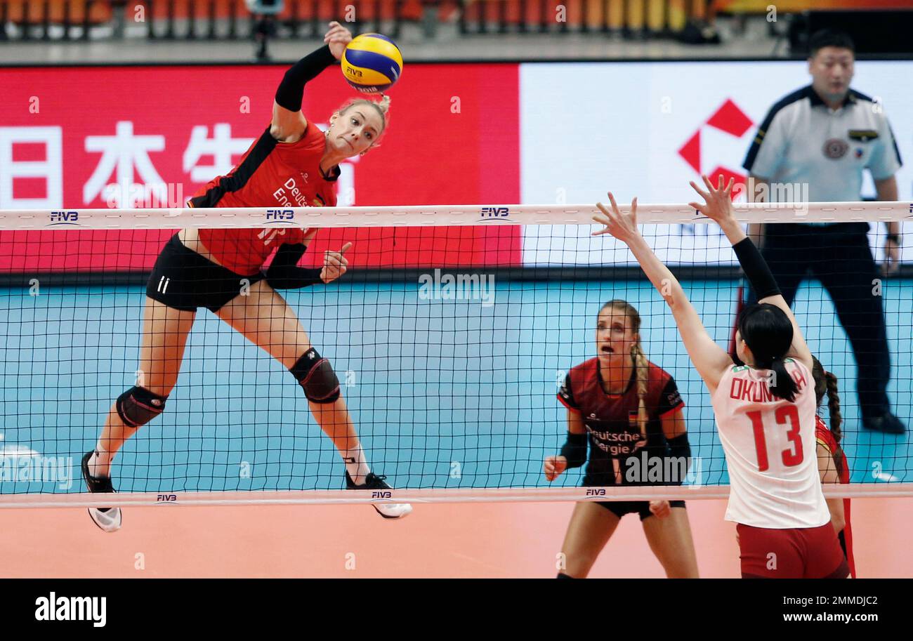 Germany's Louisa Lippmann, left, spikes during their first round Pool A ...
