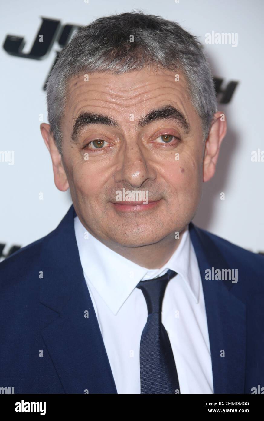 Actors Rowan Atkinson poses for photographers upon arrival for the ...