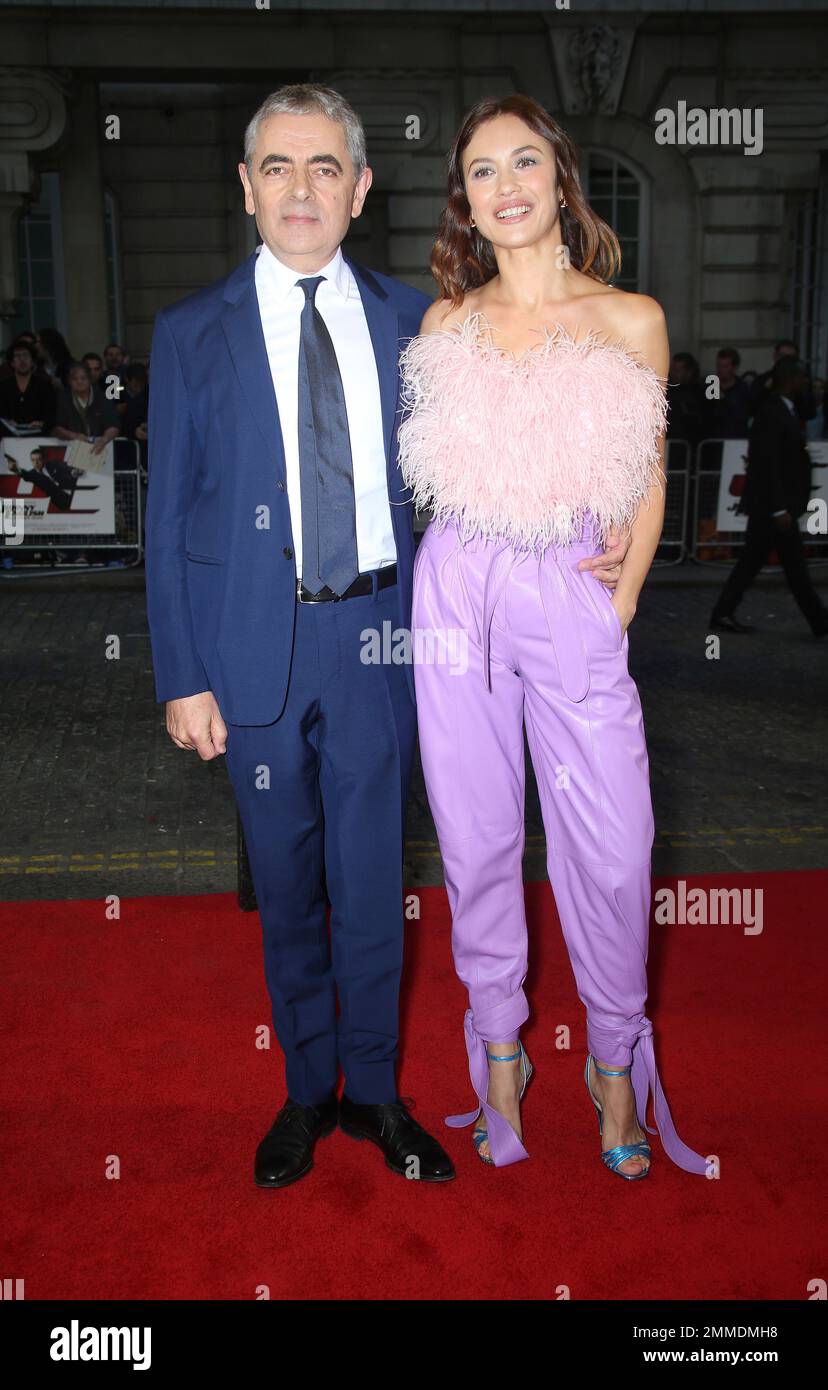 Actors Rowan Atkinson And Olga Kurylenko Pose For Photographers Upon