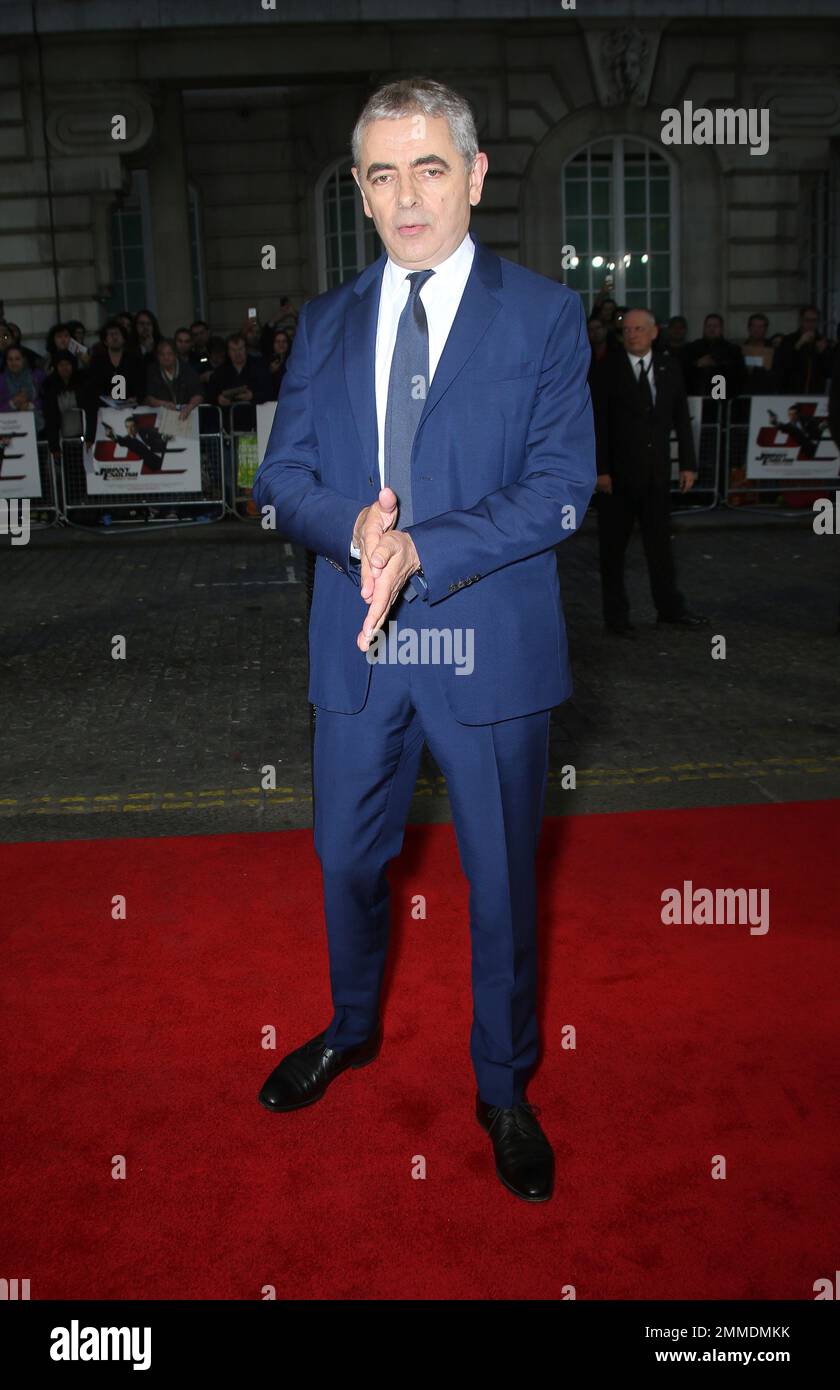Actors Rowan Atkinson poses for photographers upon arrival for the ...