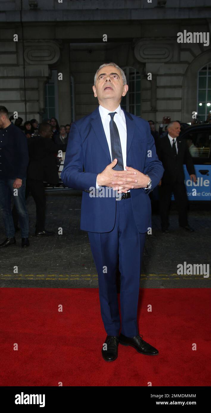 Actors Rowan Atkinson poses for photographers upon arrival for the ...