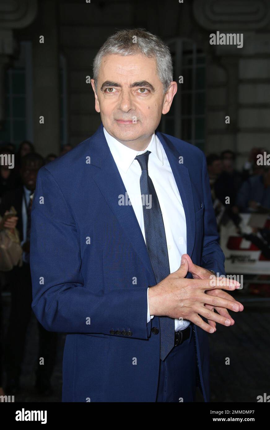 Actors Rowan Atkinson poses for photographers upon arrival for the ...