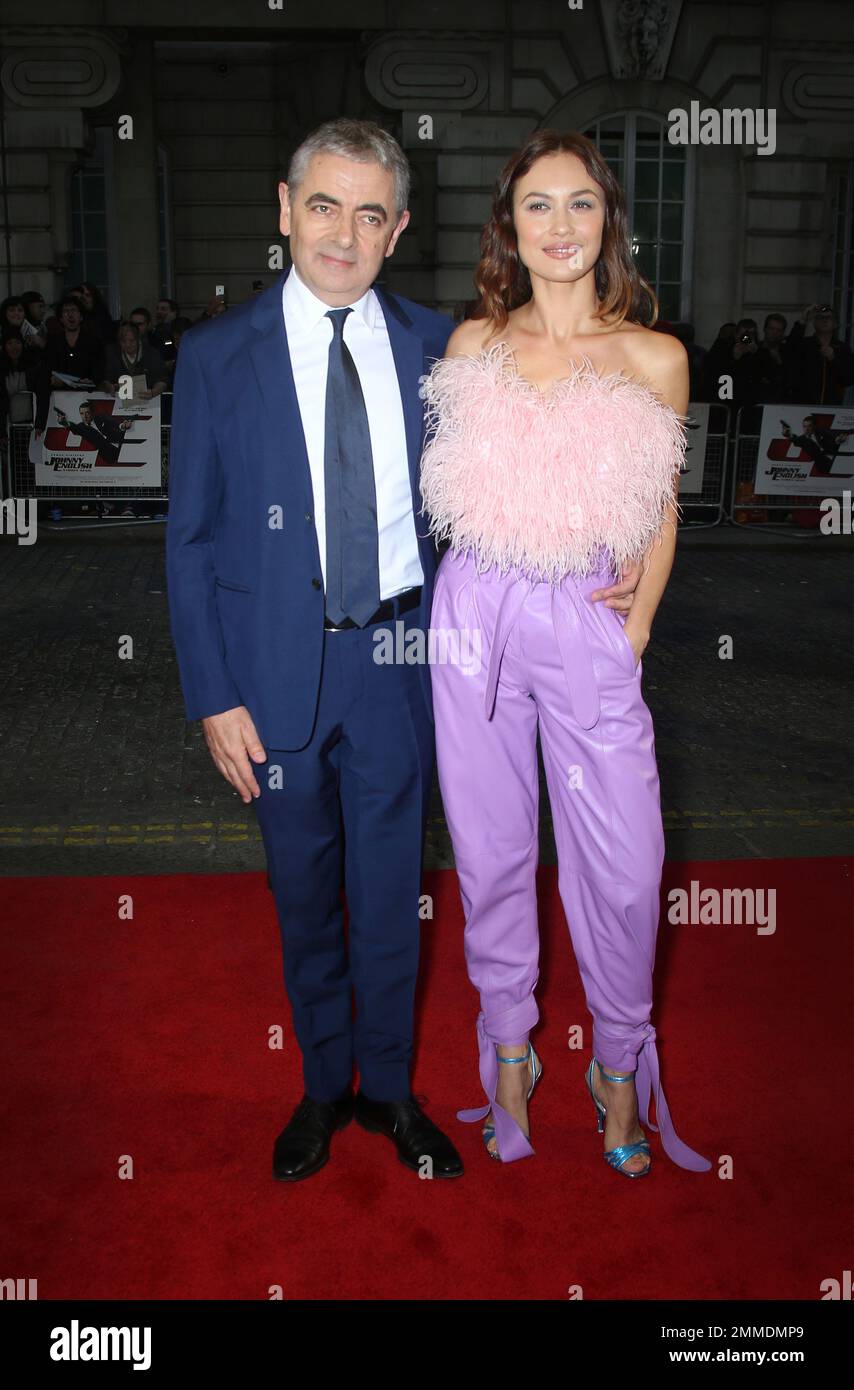Actors Rowan Atkinson And Olga Kurylenko Pose For Photographers Upon