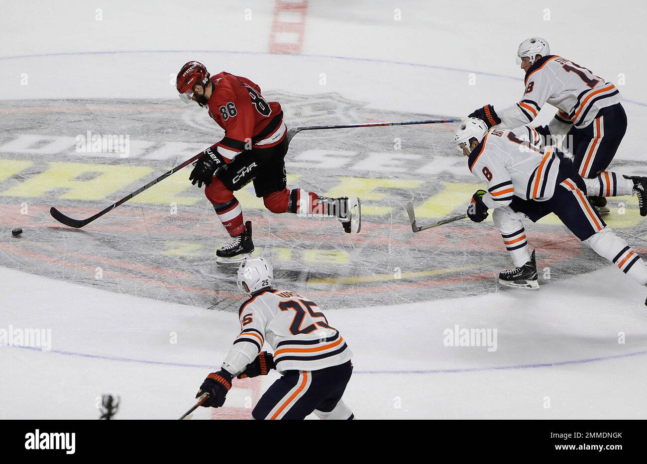 Cologne's Ben Hanowski, left, is chased by Oiler's players during a ...