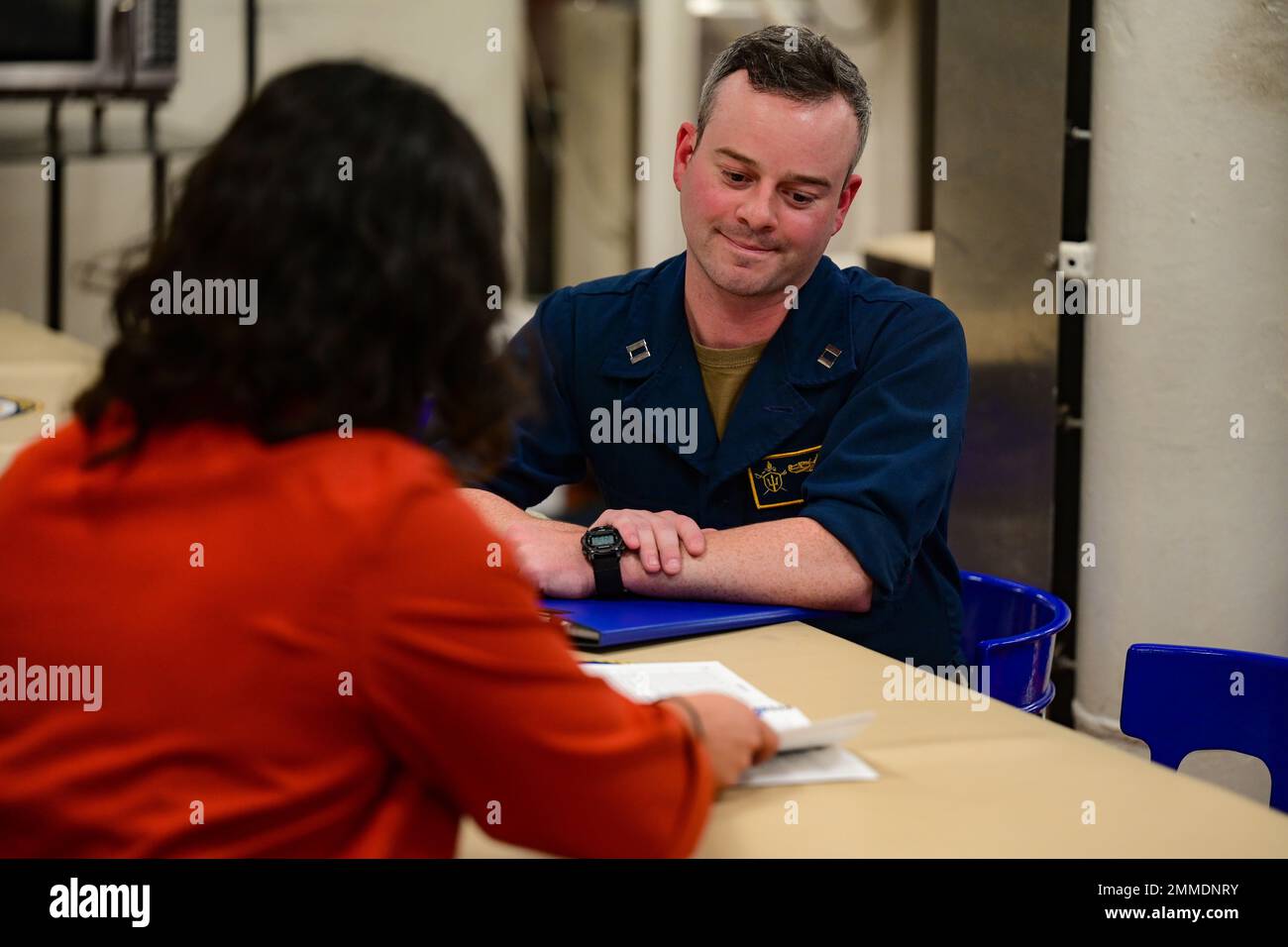U.S. Navy Lt. John Gwin, right, an integrated air and missile defense ...