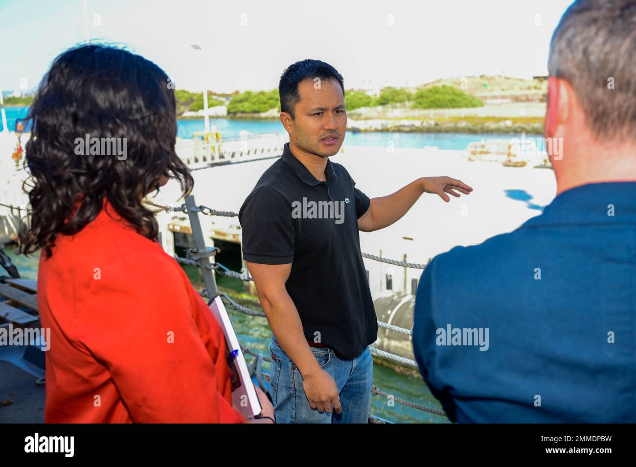 A training and data analytics team meet on the quarterdeck of the ...